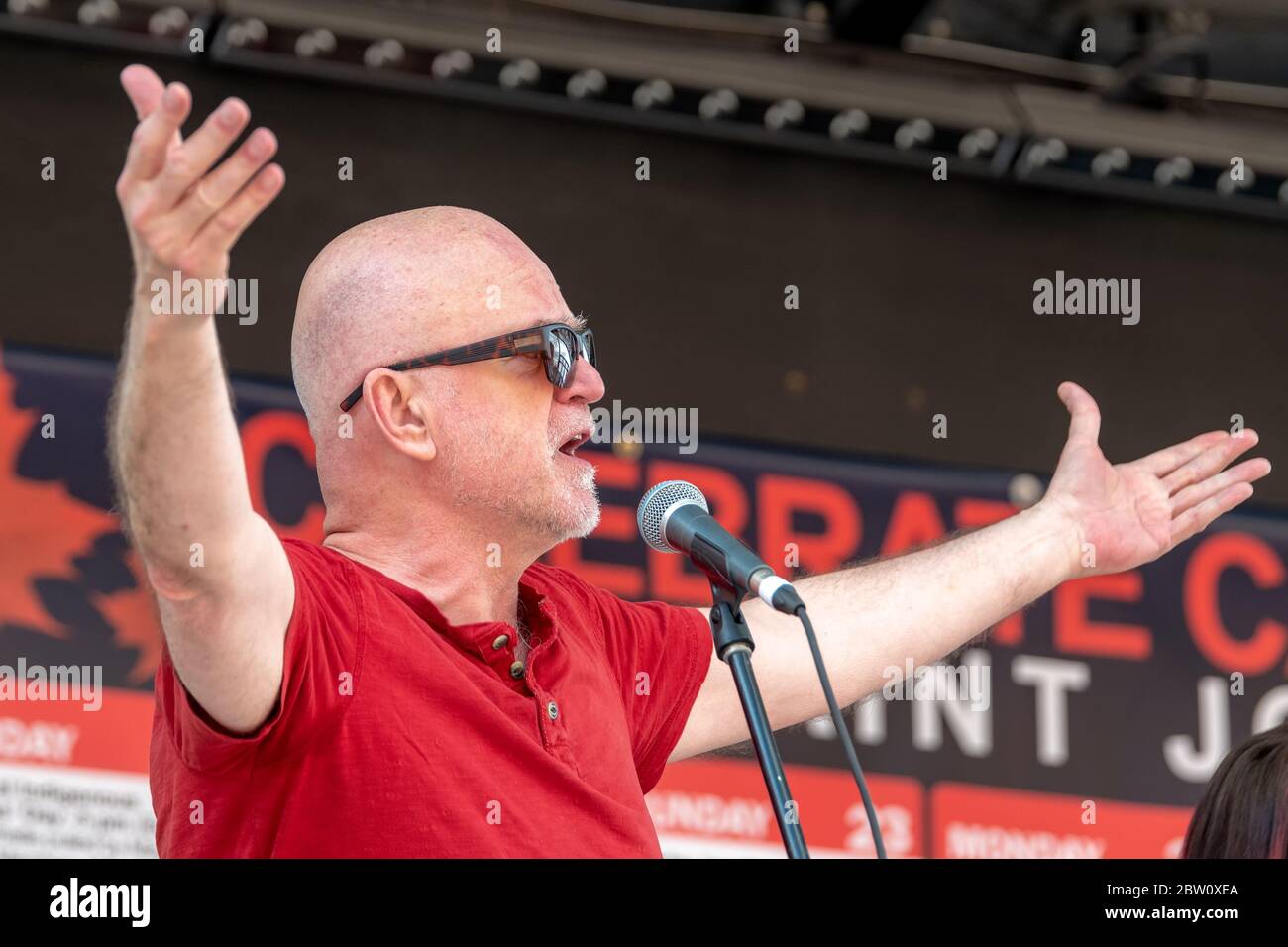 Saint John, New Brunswick, Canada - July 1, 2019: A man sings in a free ...