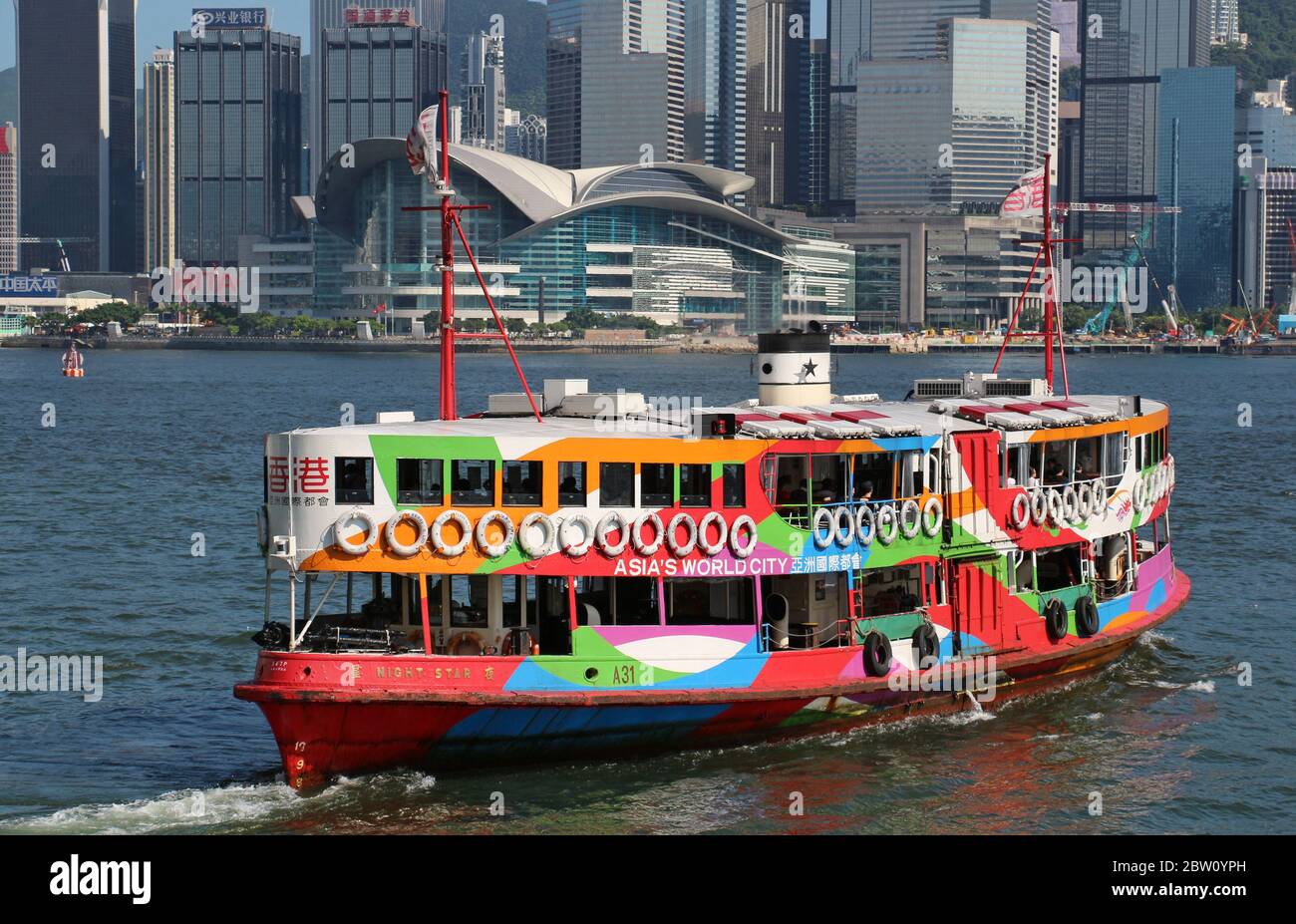 The Star Ferry with a colourful Asia's World City livery. Focus on ...