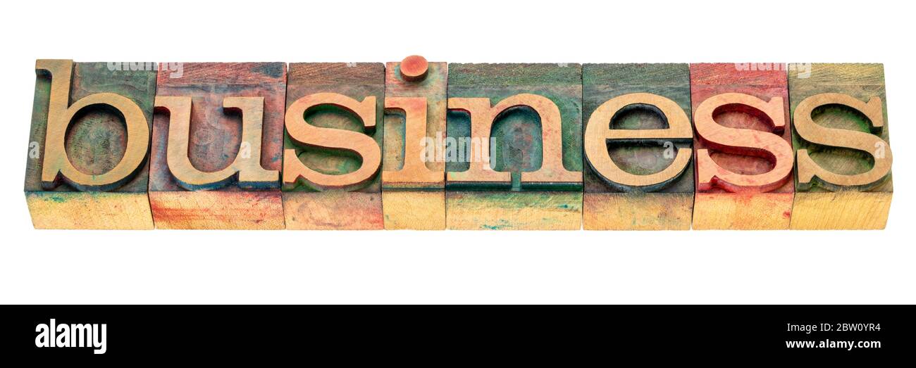 business isolated word in letterpress wood type blocks stained by color ...