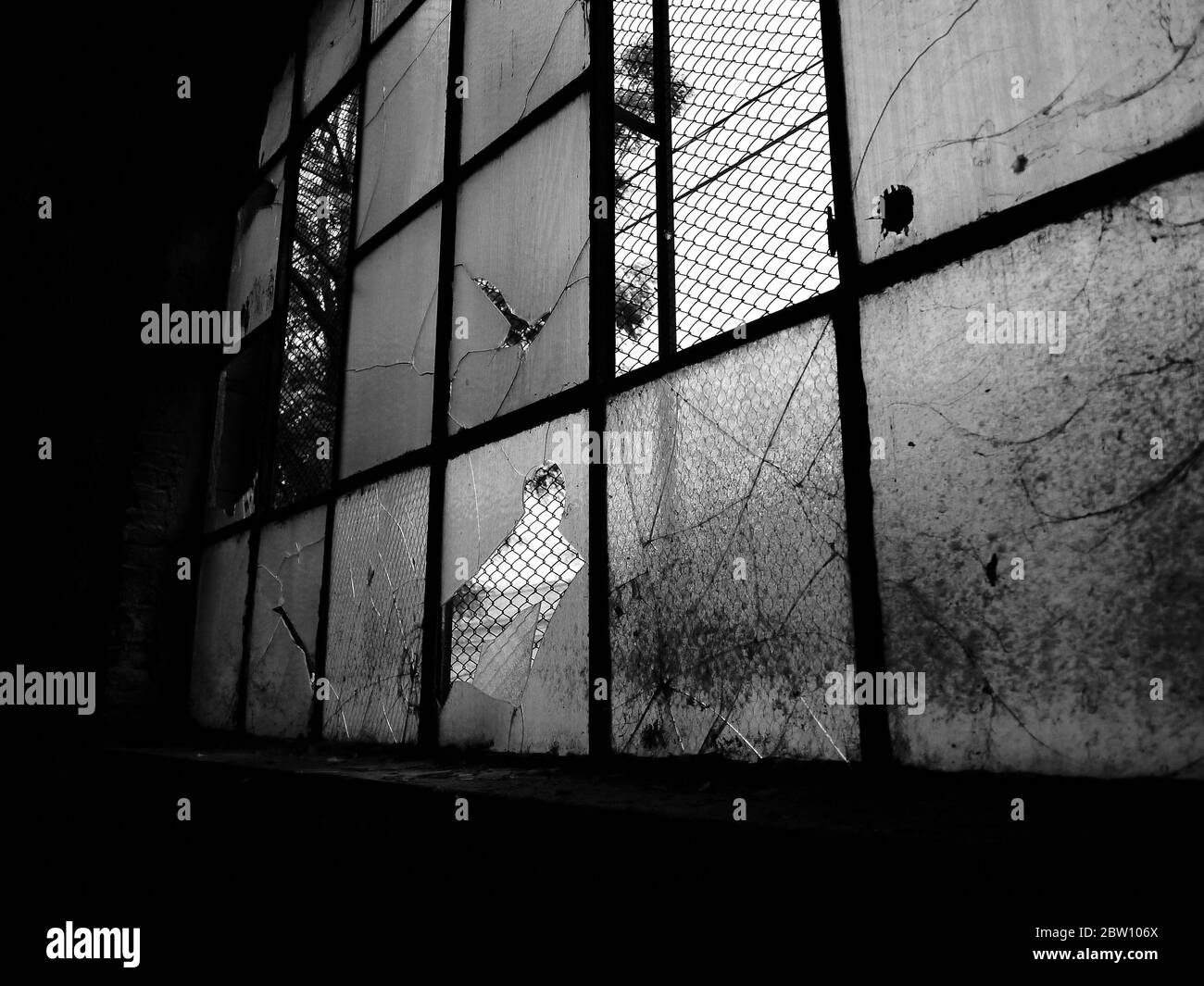 Looking through a broken window Stock Photo - Alamy