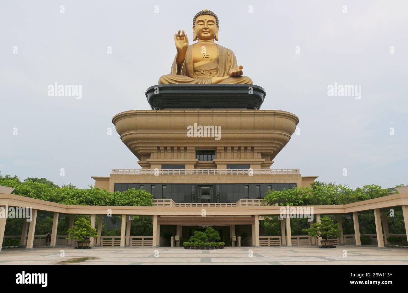 The Fo Guang Shan Monastery, a giant golden praying Buddha on top of a ...