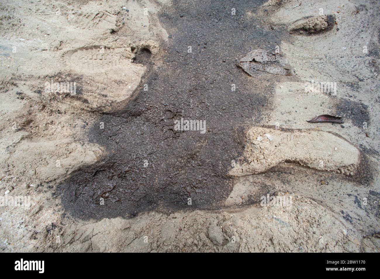 Black oil marks on the beach Which is harmful to the environment Stock ...