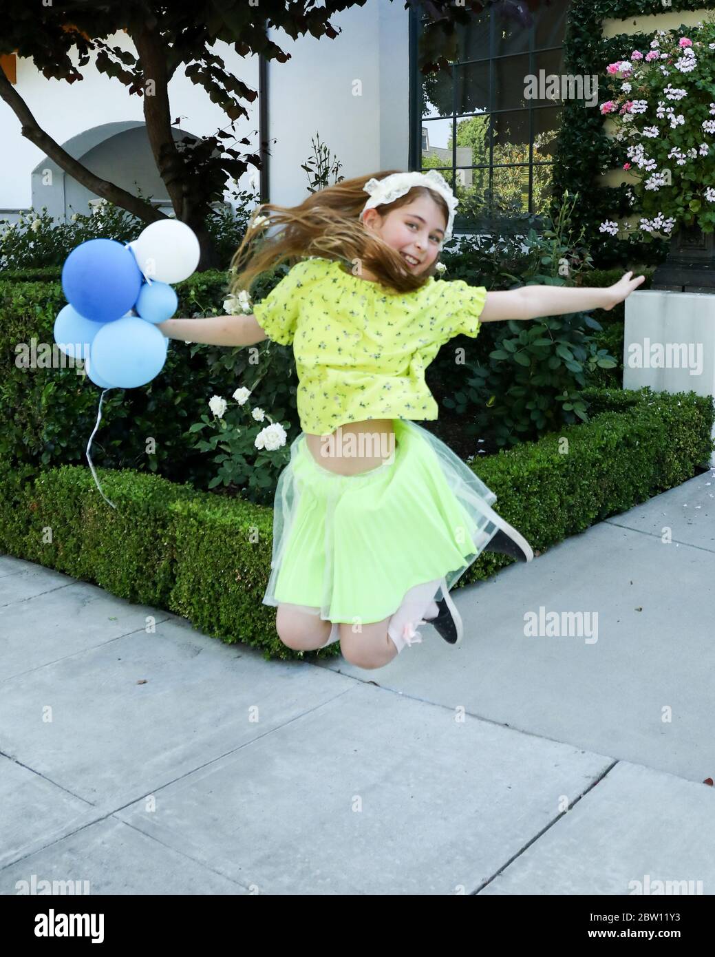 Pasadena, California, USA. 27th May, 2020. Actress Kayla Bohan jumps in ...