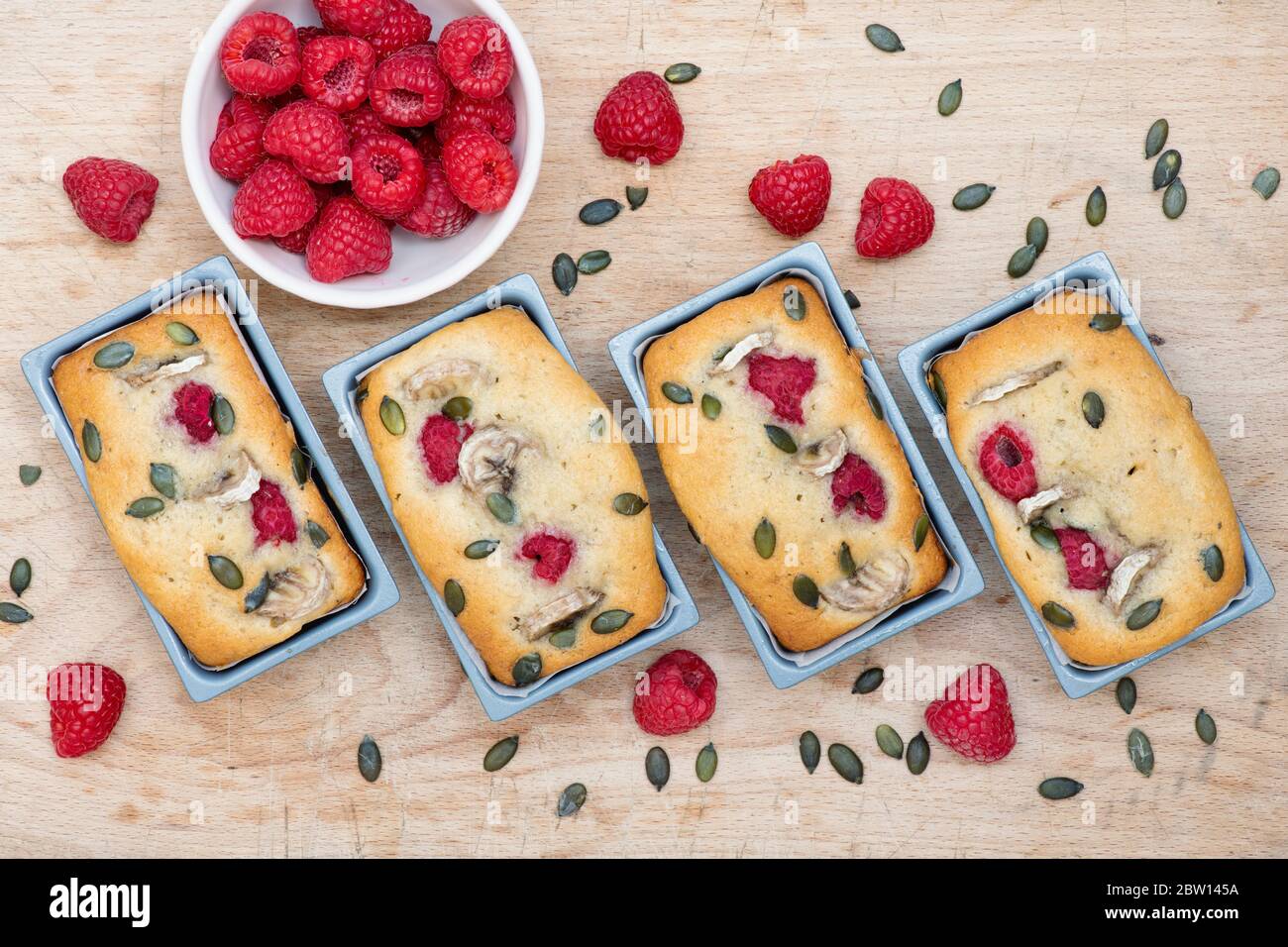 Homemade mini banana and raspberry loaf cakes Stock Photo - Alamy