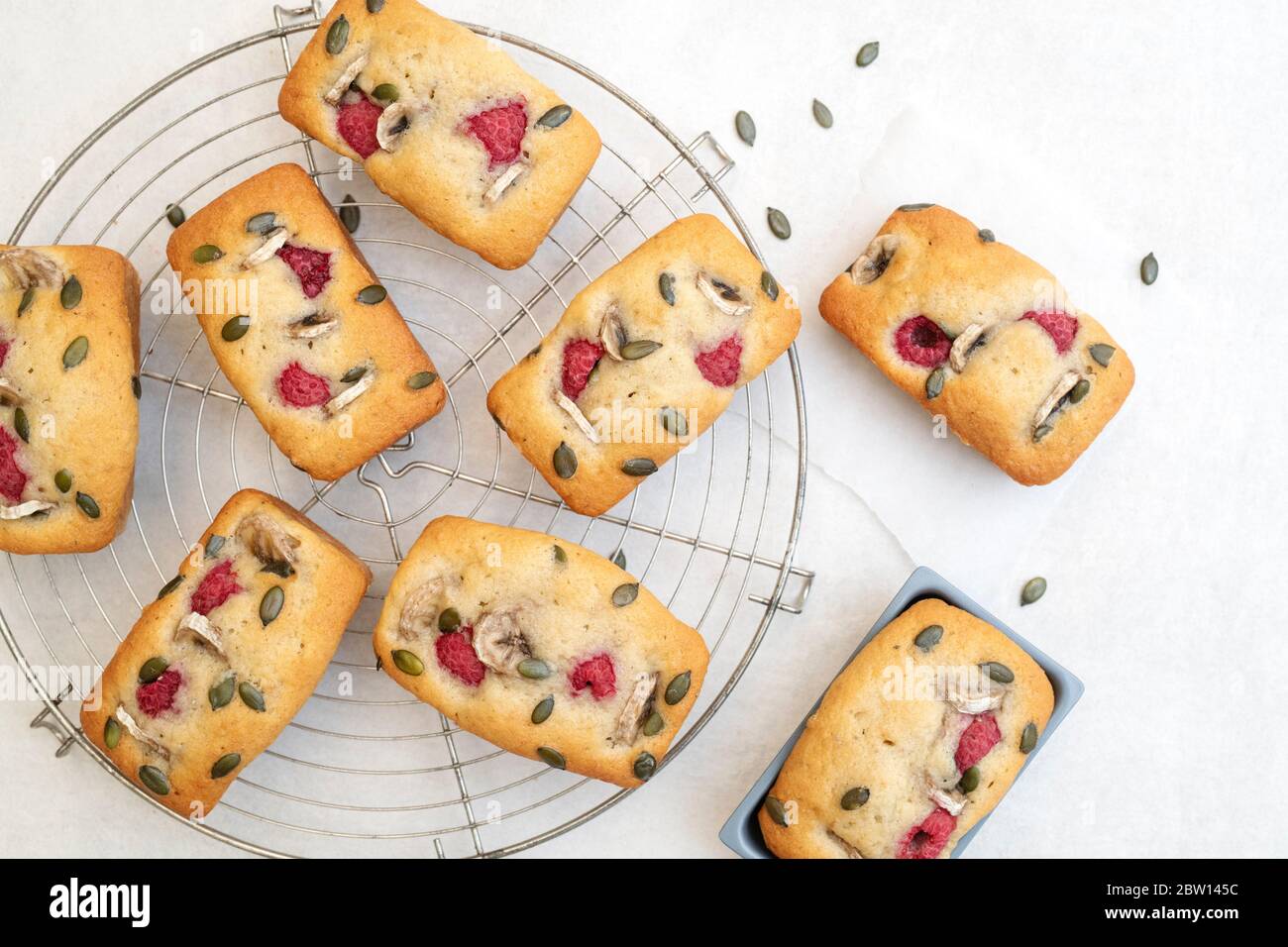 Homemade mini banana and raspberry loaf cakes Stock Photo - Alamy