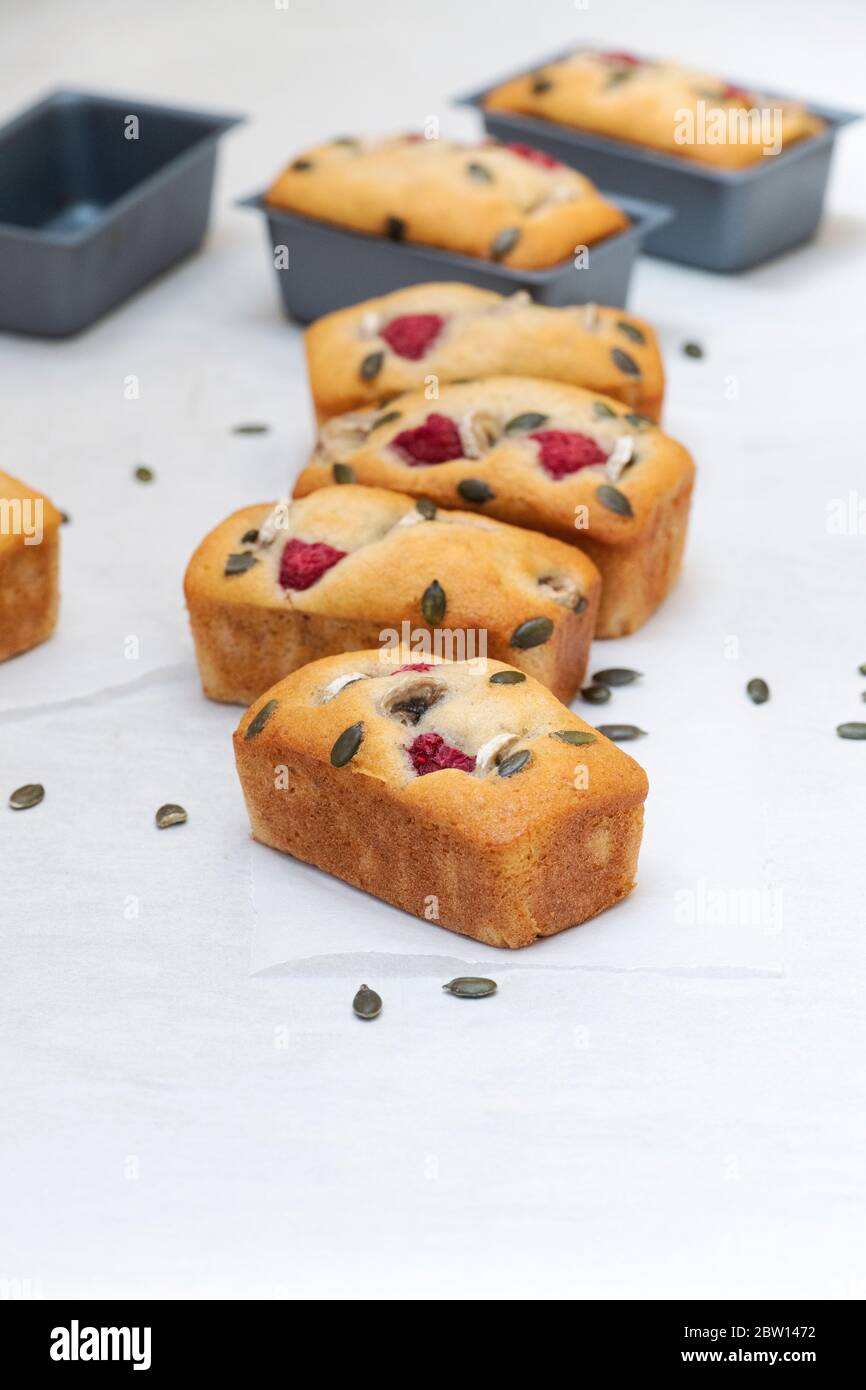 Homemade mini banana and raspberry loaf cakes Stock Photo - Alamy