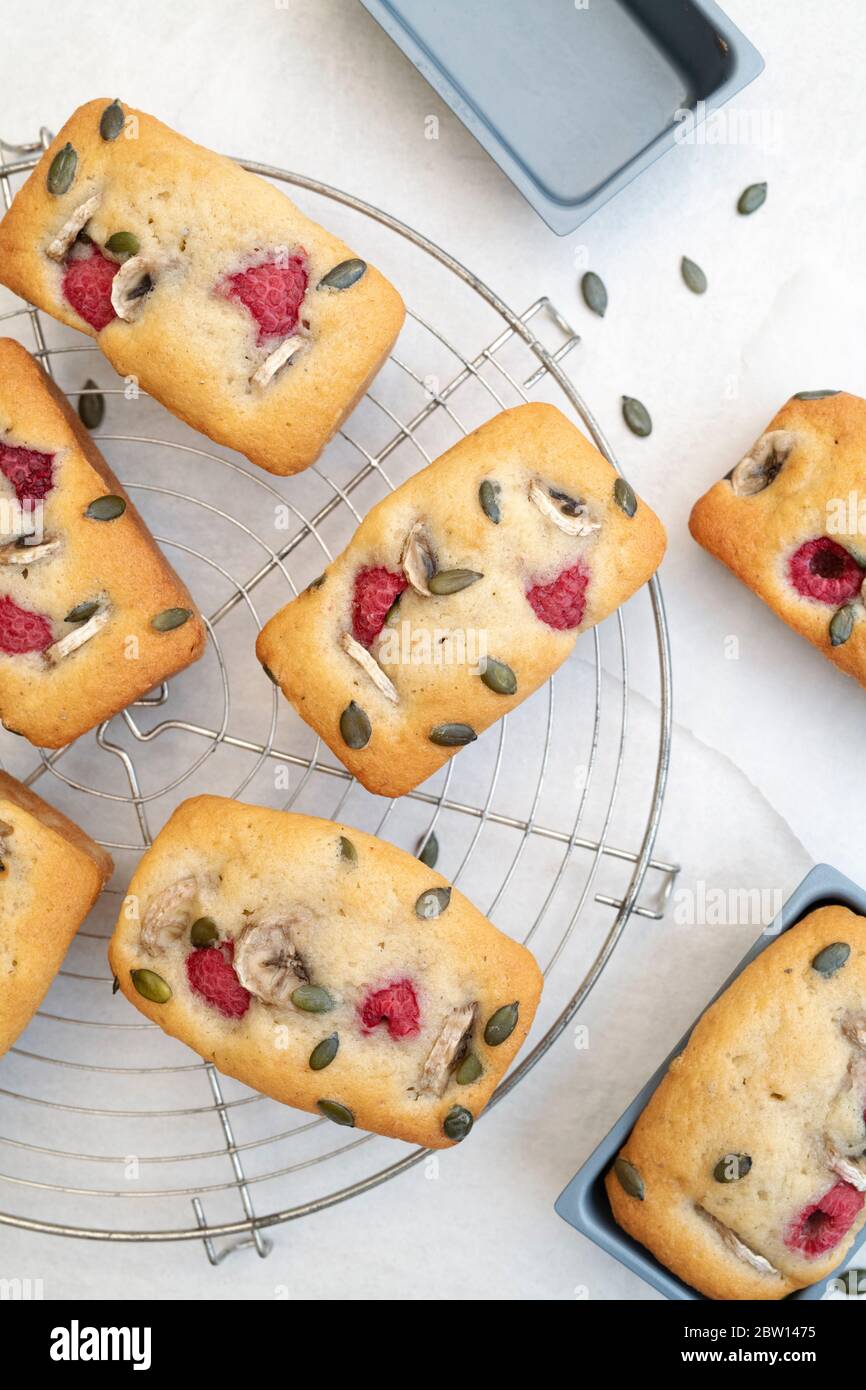 Homemade mini banana and raspberry loaf cakes Stock Photo - Alamy