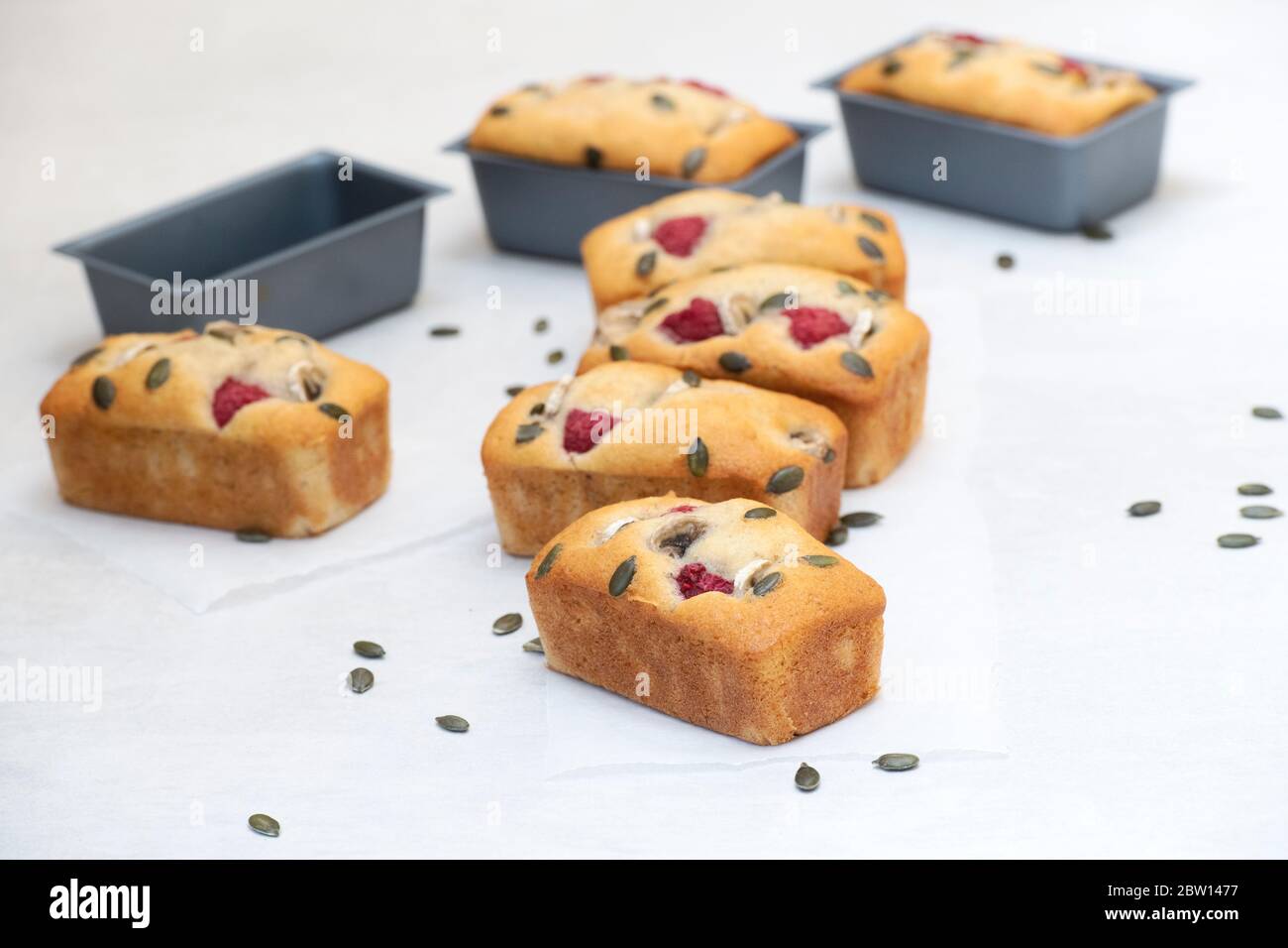 Homemade mini banana and raspberry loaf cakes Stock Photo - Alamy