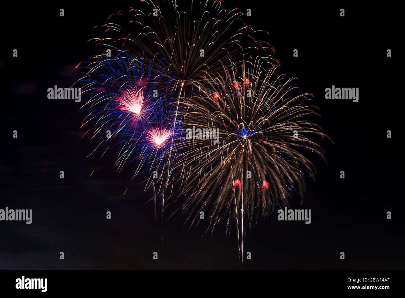 Colorful fireworks display at holiday night Stock Photo - Alamy