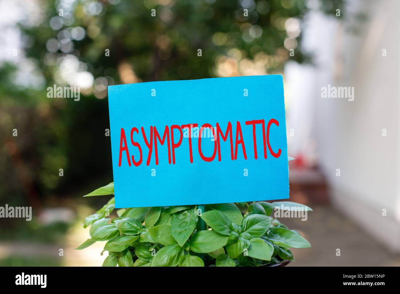 Writing note showing Asymptomatic. Business concept for a condition or ...