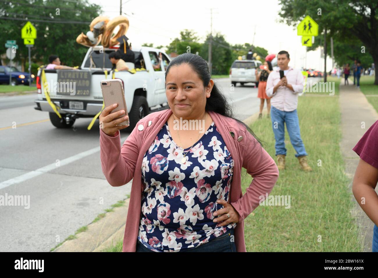 Family members and neighbors watch graduates of Navarro Early College ...