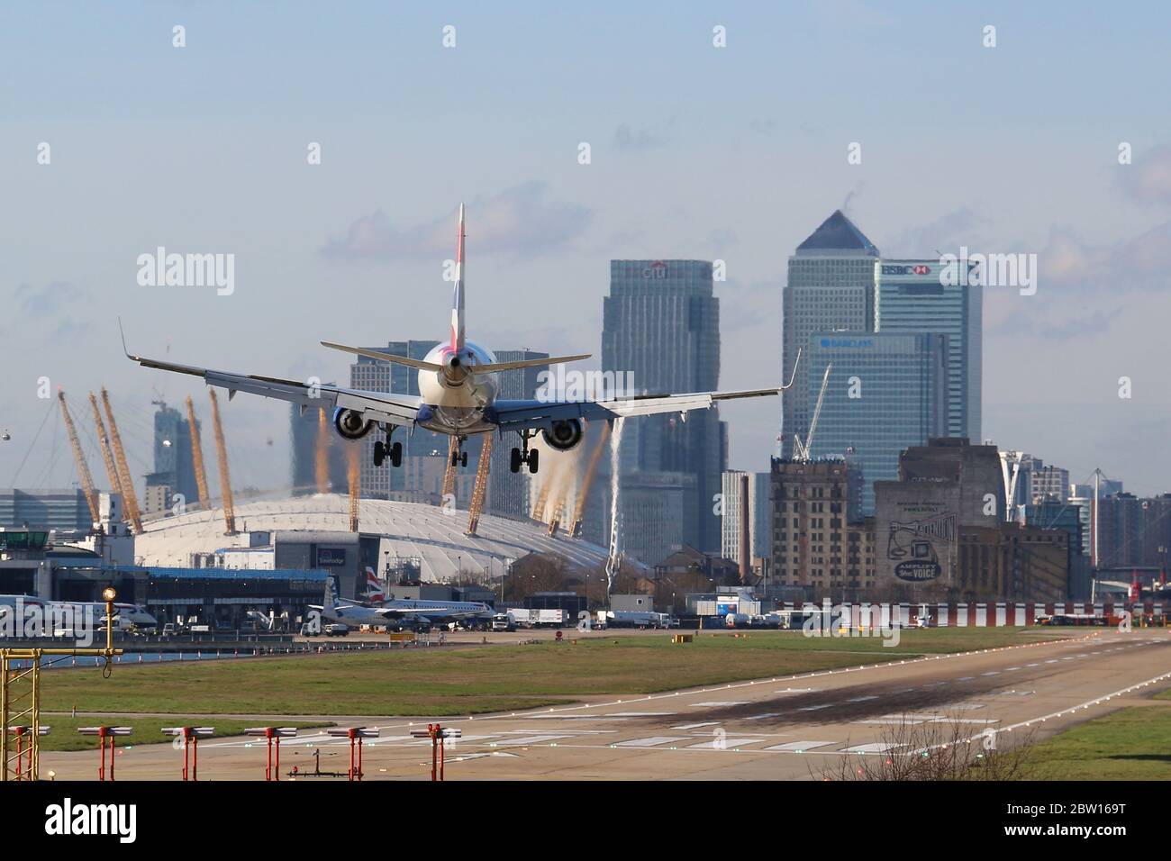 British Airways Plane landing at London's City Airport on a sunny day ...