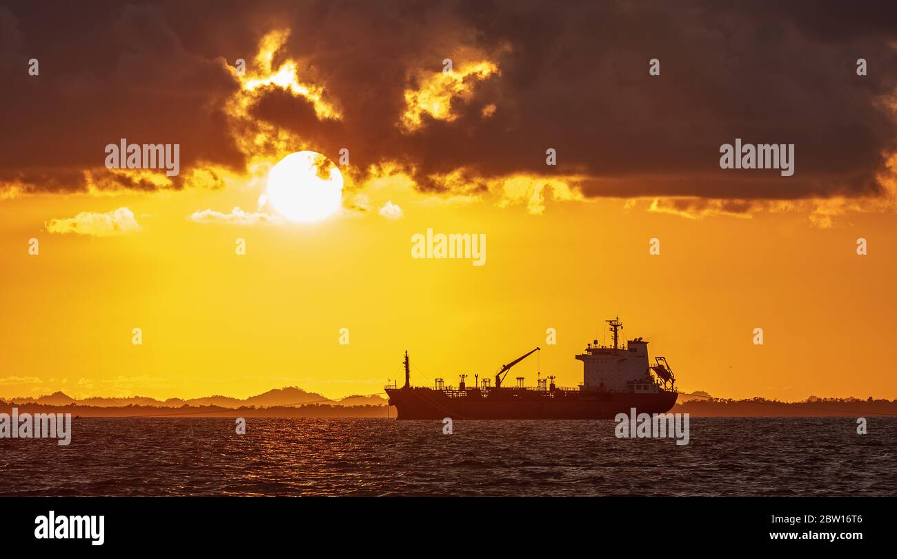 Oil tanker sailing by the coast of Belize in Central America. Sunset ...