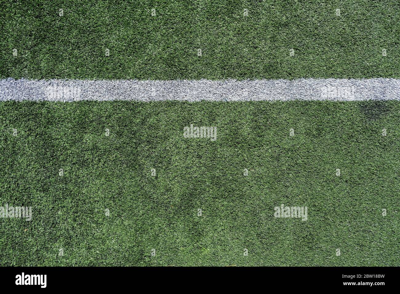 White stripe on a bright green artificial grass soccer field Stock ...