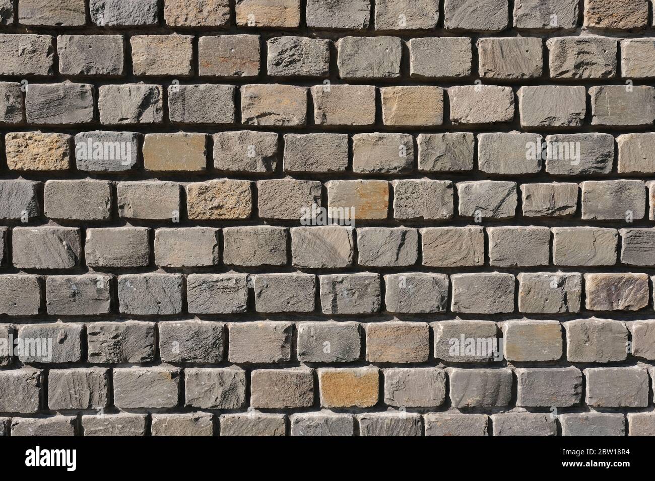 Stone wall texture background natural color Stock Photo - Alamy