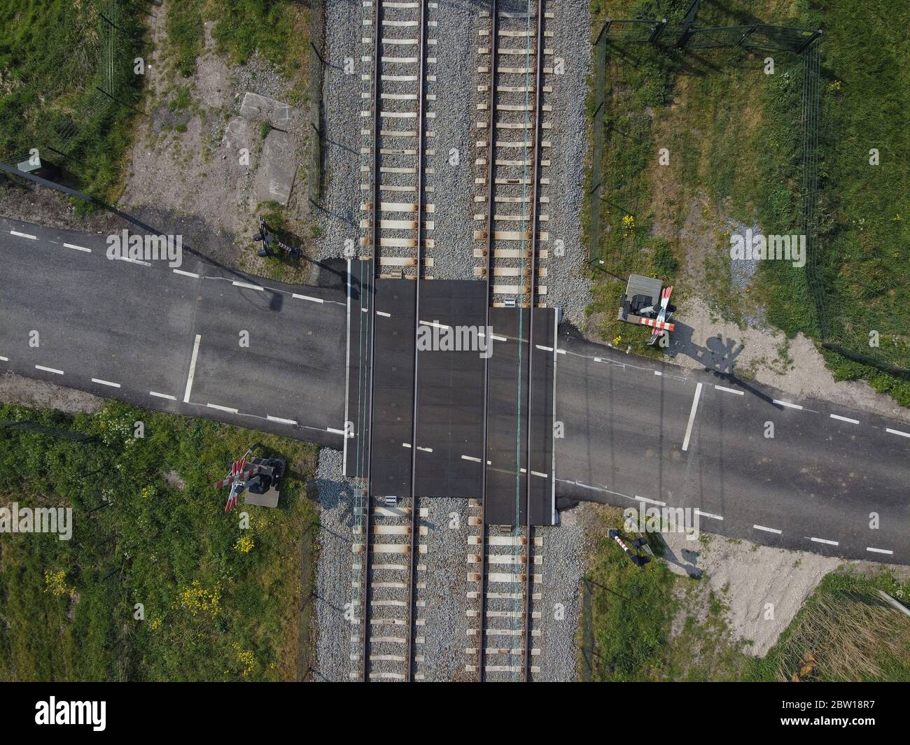 Railroad crossing and Train Tracks from Above. Aerial view Stock Photo ...