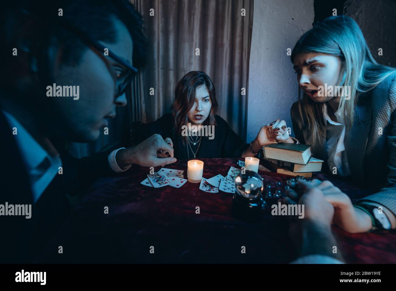 People hold hands of night at table with candles Stock Photo - Alamy