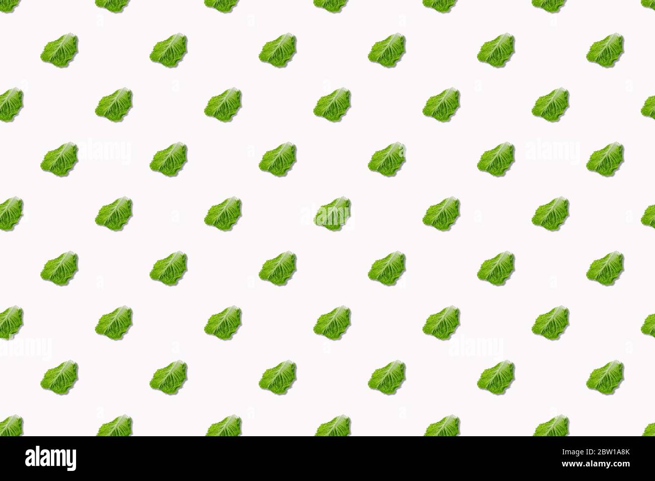 Green leaf lettuce pattern on a white background Stock Photo - Alamy