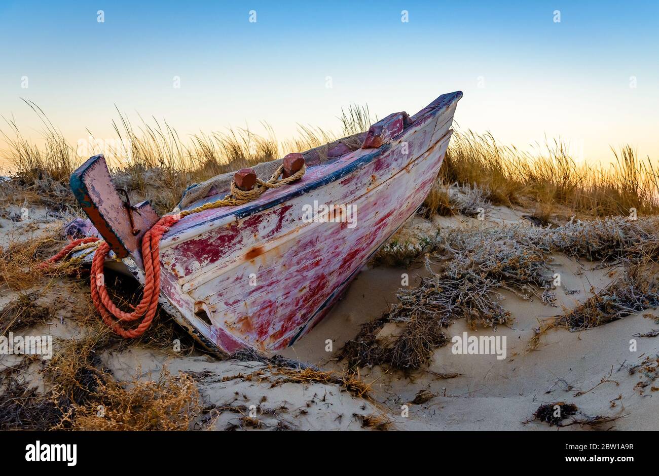 Bleeding body. An abandoned boat at Plaka beach, Naxos, Greece, in the ...
