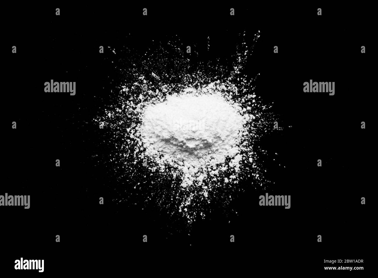 White powder isolated on the black background Stock Photo - Alamy