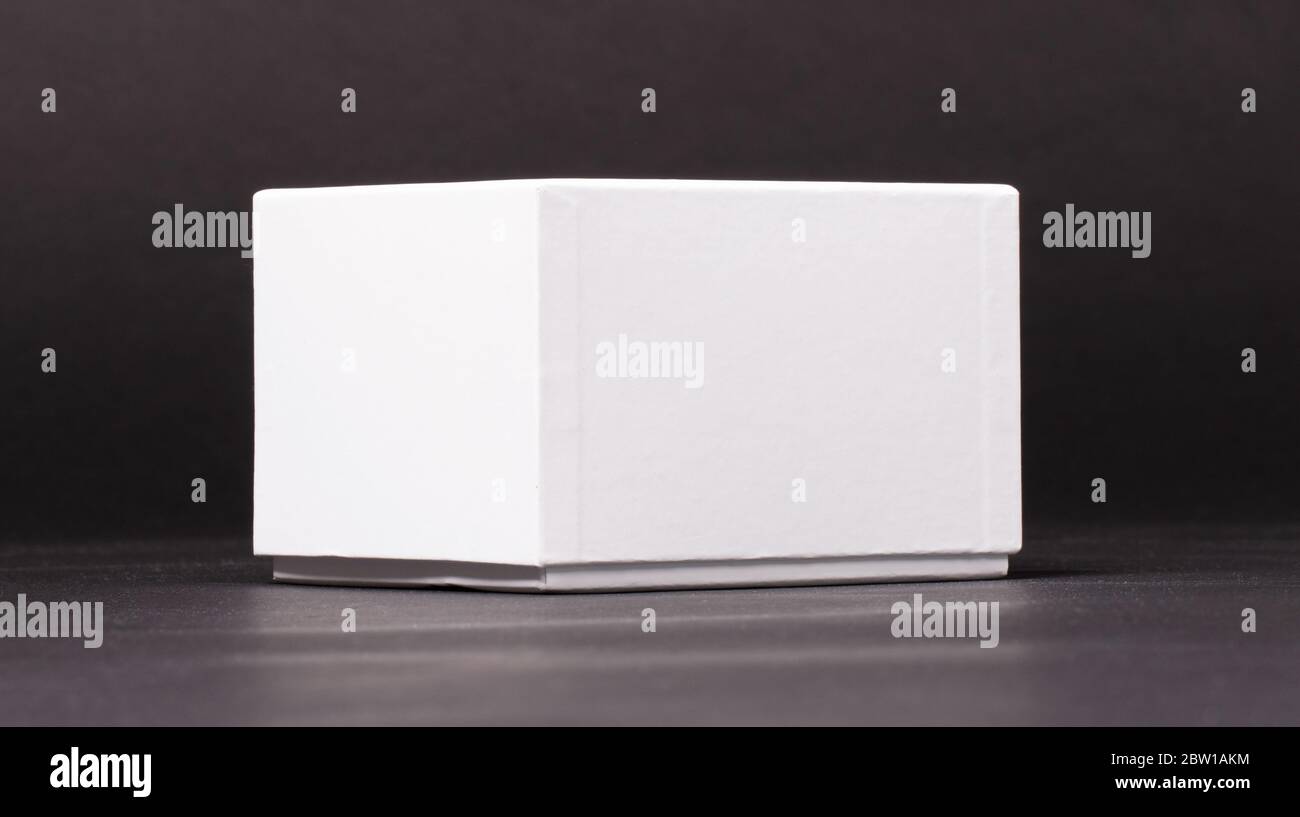 Blank White box isolated on a black background Stock Photo - Alamy