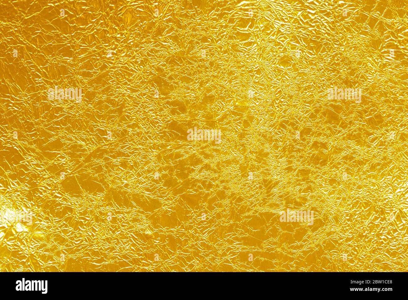 Gold foil abstract background texture Stock Photo - Alamy