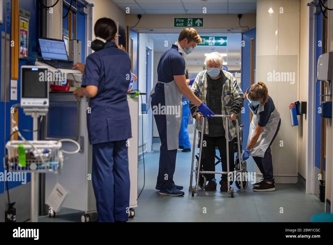 Rehab Support workers perform a physiotherapy treatment on patient ...