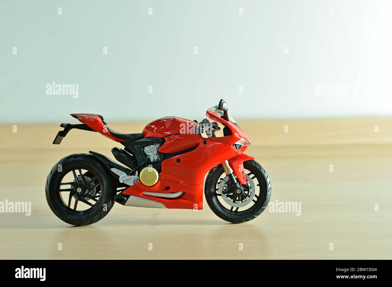 Red motorcycle toy in with background Stock Photo - Alamy