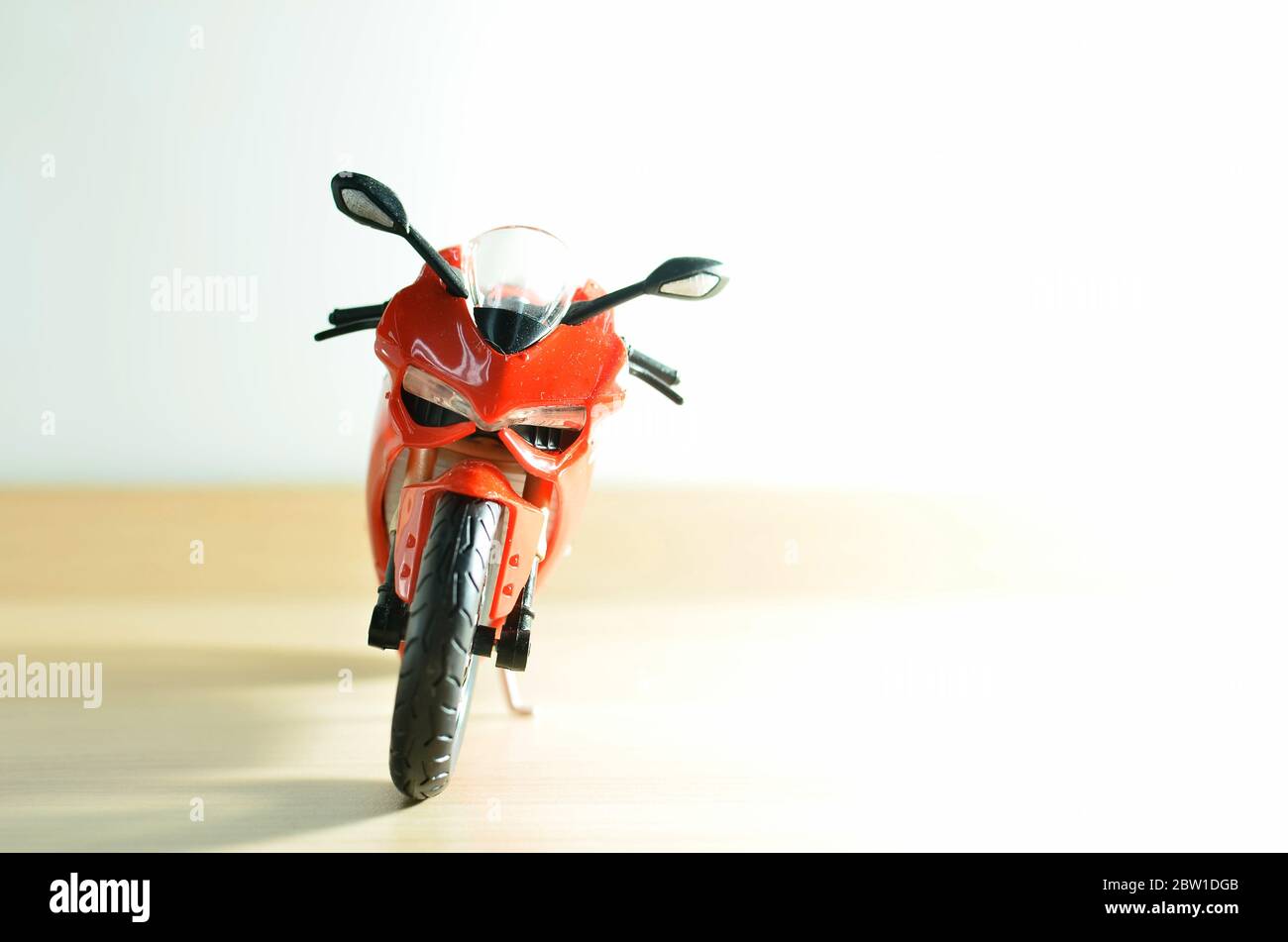 Red motorcycle toy in with background Stock Photo - Alamy