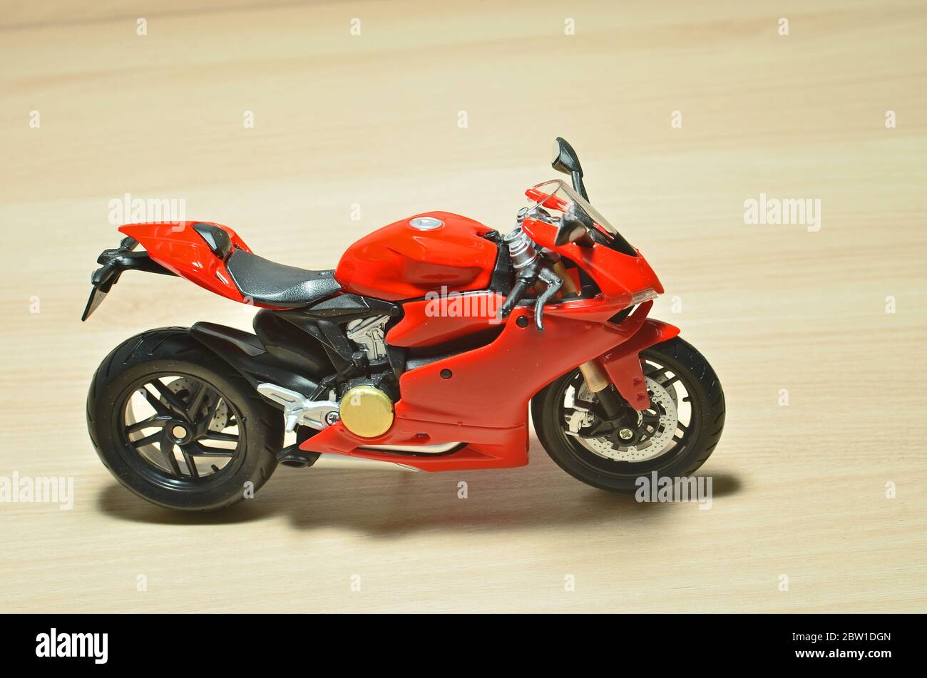 Red motorcycle toy in with background Stock Photo - Alamy