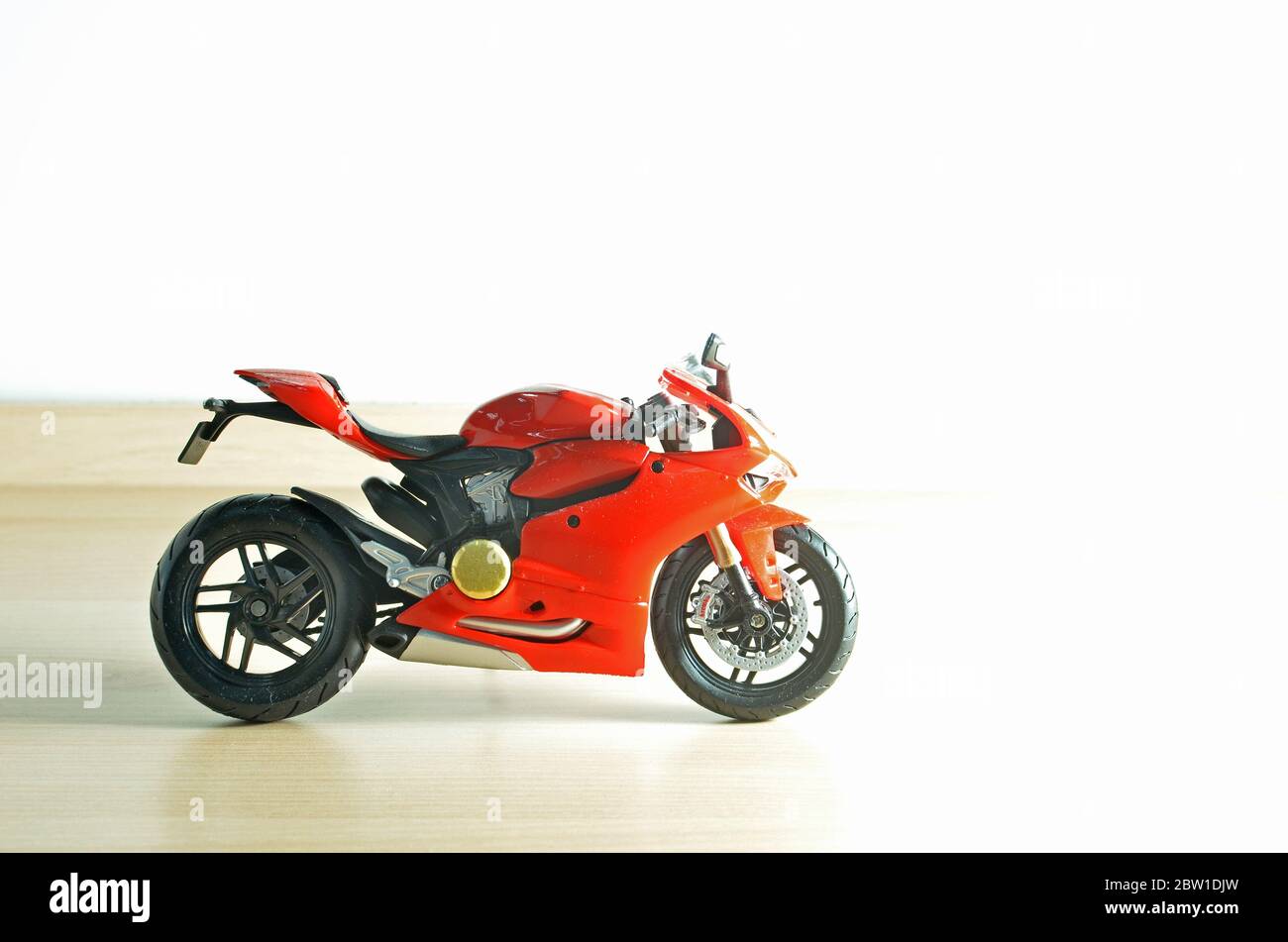 Red motorcycle toy in with background Stock Photo - Alamy