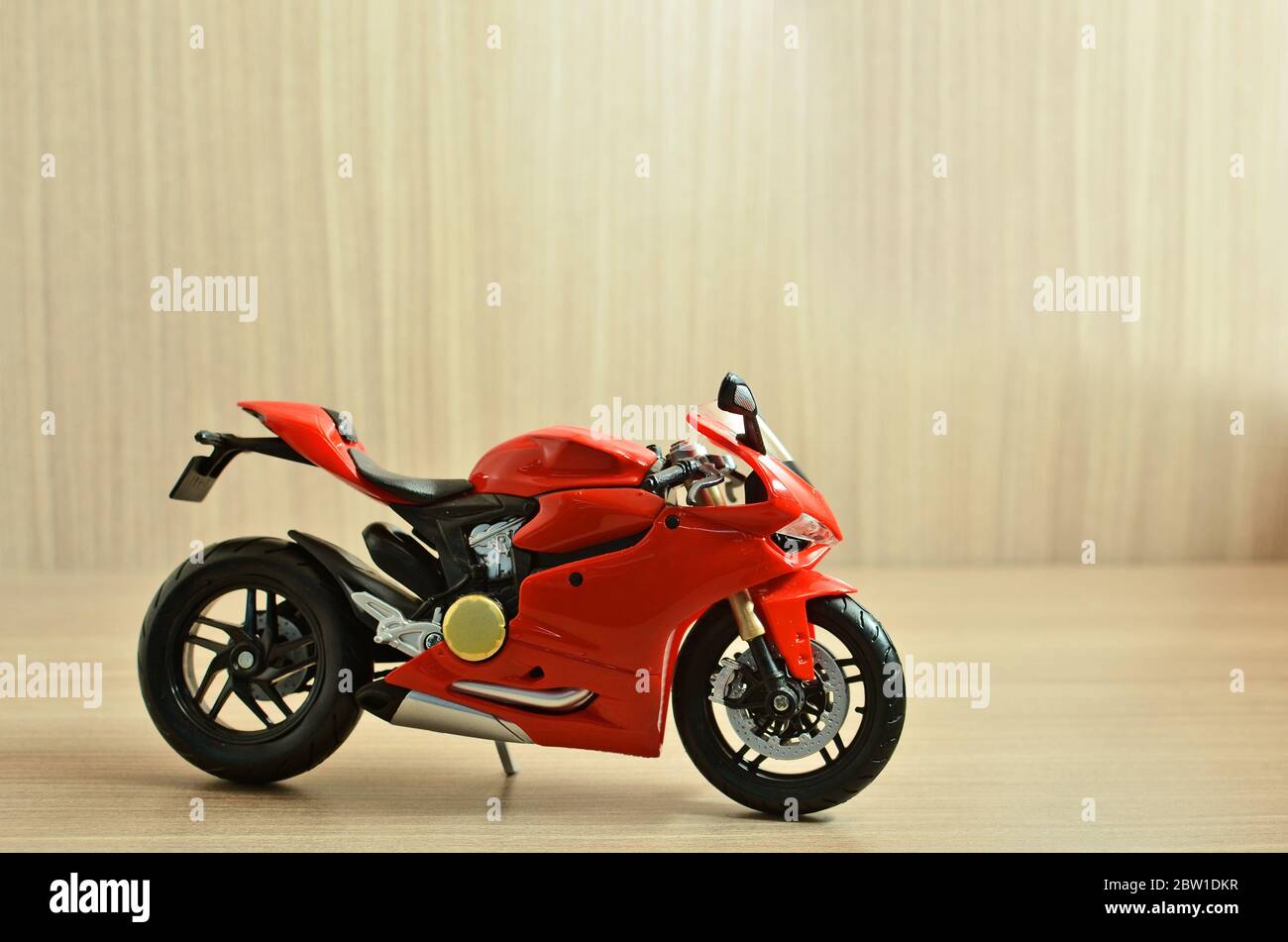 Red motorcycle toy in with background Stock Photo - Alamy