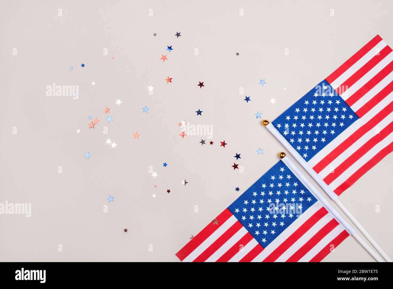 Festive background with US flags and confetti Stock Photo - Alamy