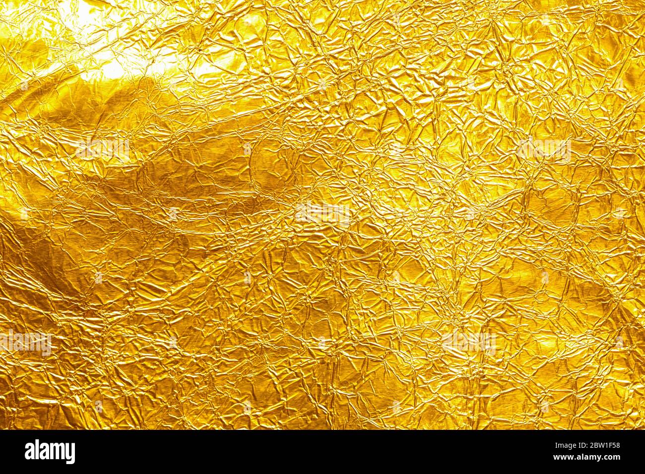 Gold foil abstract background texture Stock Photo - Alamy