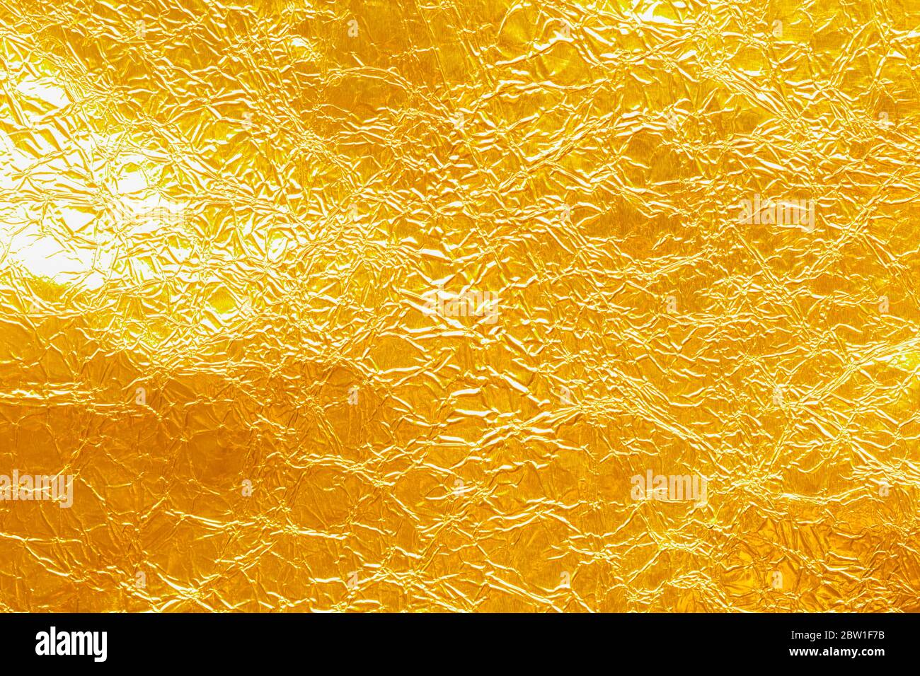 Gold foil abstract background texture Stock Photo - Alamy
