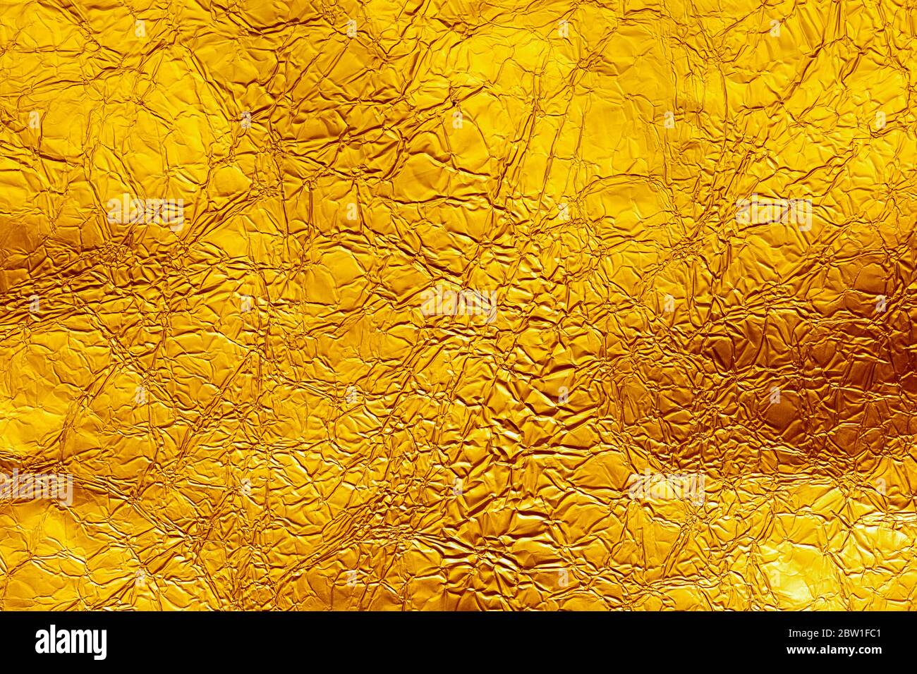 Gold foil abstract background texture Stock Photo - Alamy