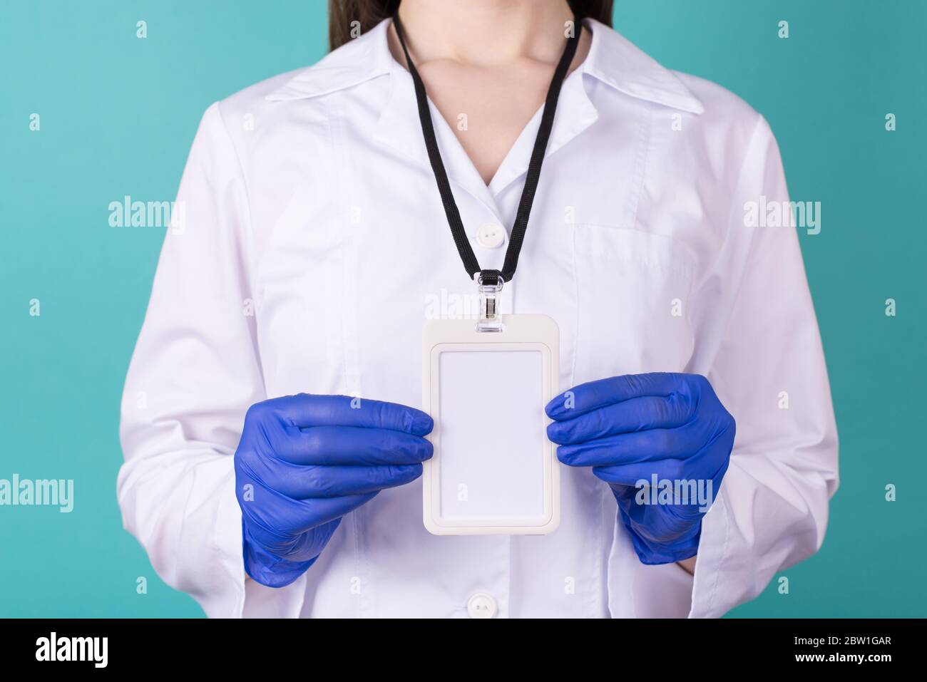 Close-up cropped photo of female doctor in gloves wearing white coat ...
