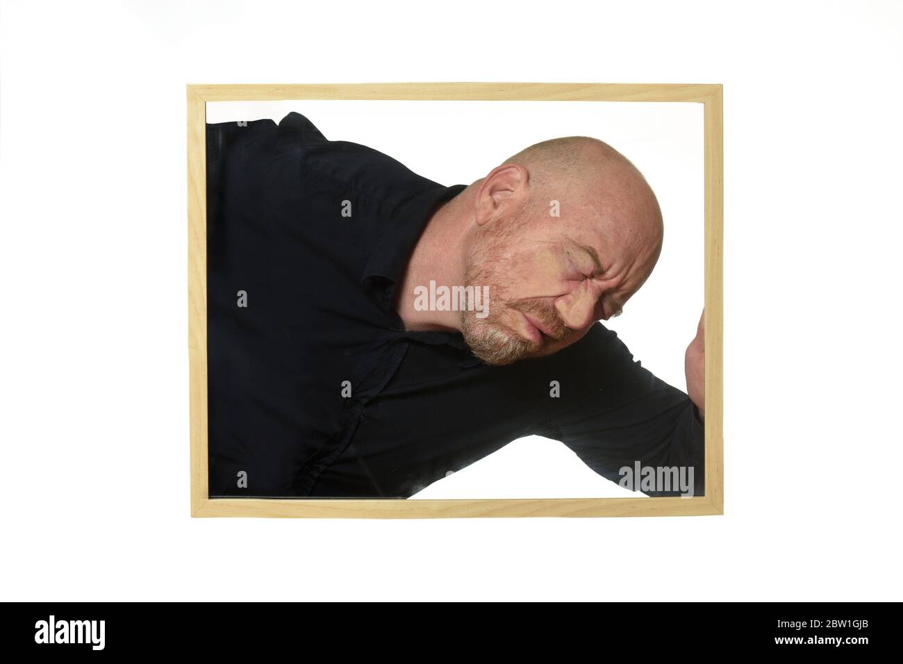 man locked in a frame Stock Photo - Alamy