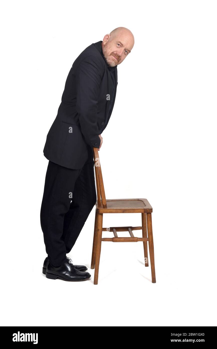 Man standing feet on chair hi-res stock photography and images - Alamy