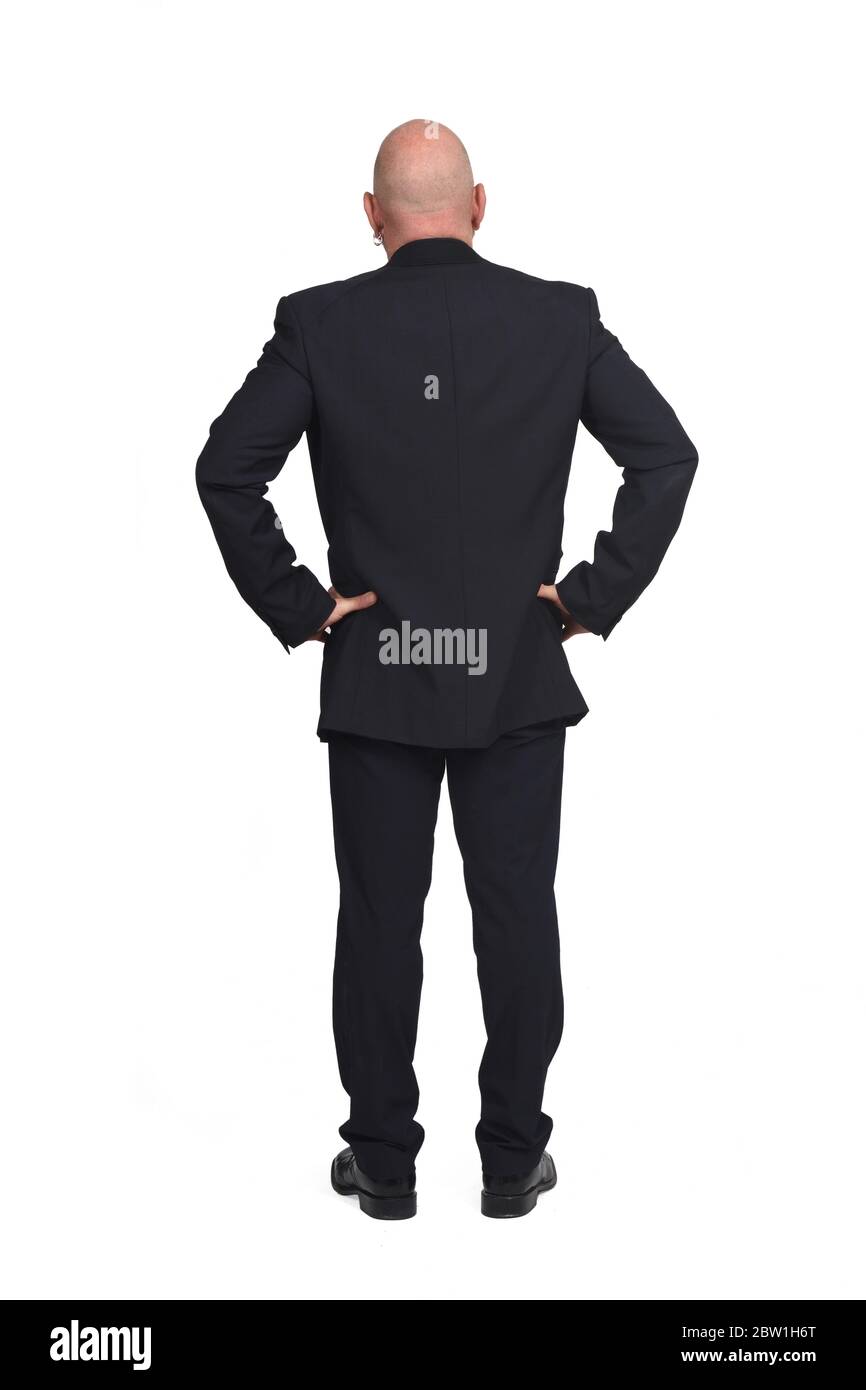 full portrait of a man from behind on white background, hands on hip ...