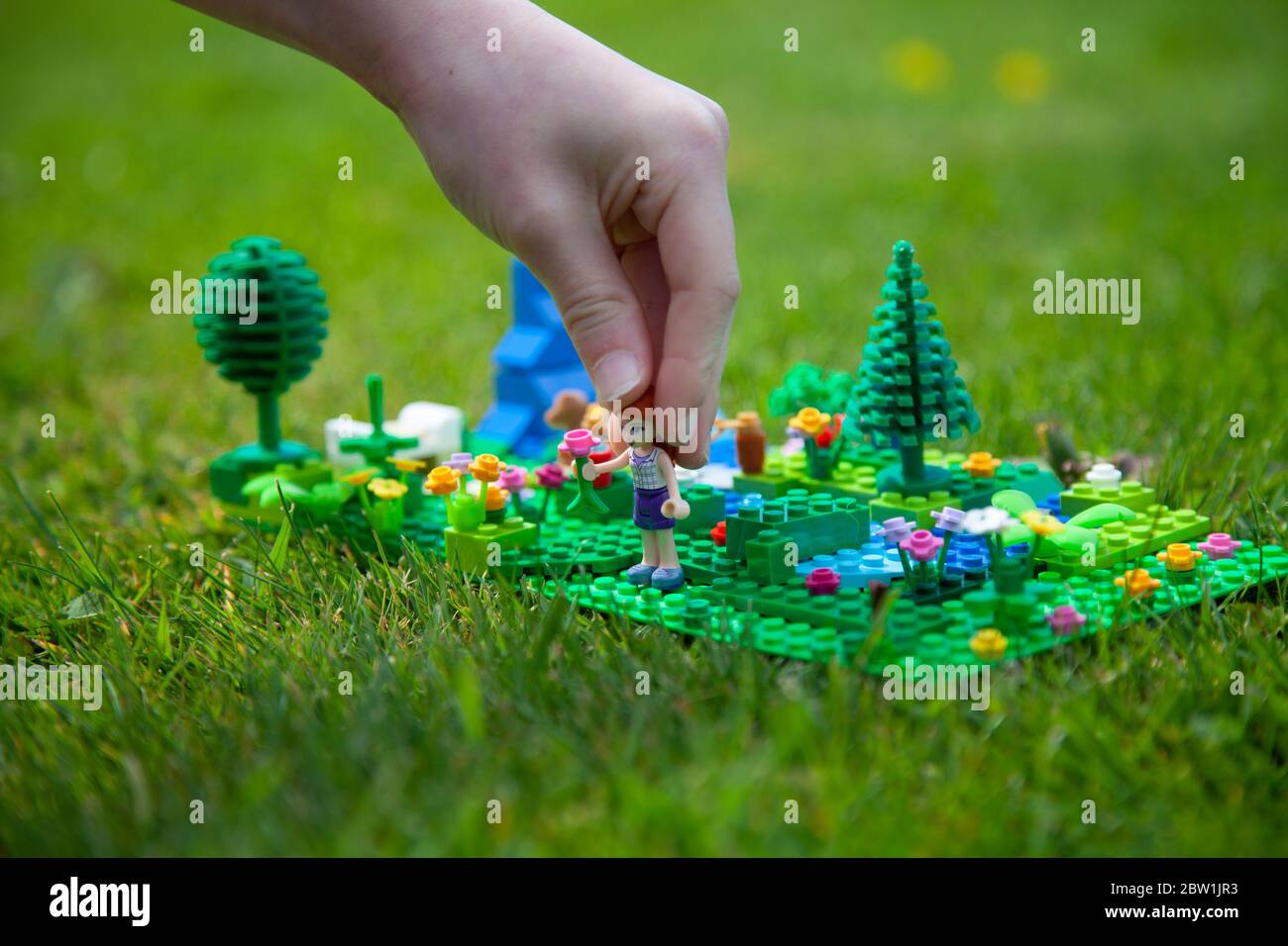 Children's Lego garden and house layouts photographed on the lawn ...