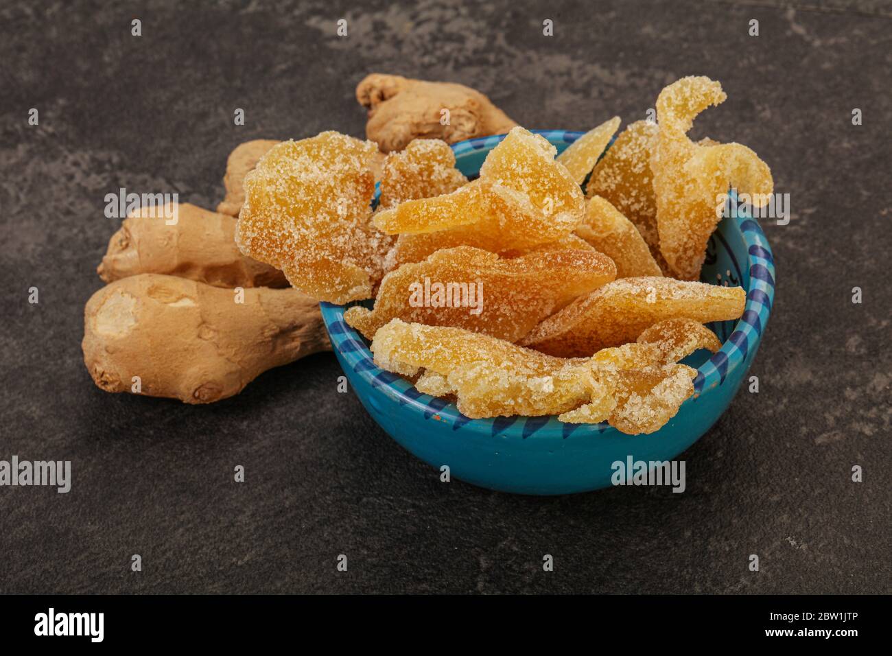 Dry sweet ginger snack in the bowl Stock Photo - Alamy