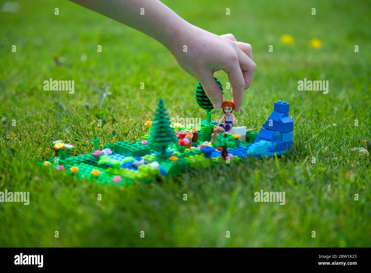 Children's Lego garden and house layouts photographed on the lawn ...