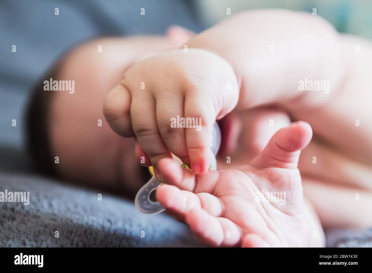 A portrait of adorable baby lying Stock Photo - Alamy