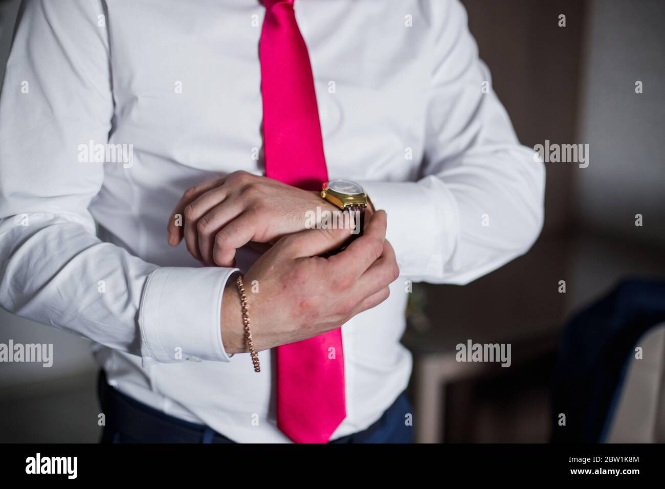 man puts watch on his hand Stock Photo - Alamy