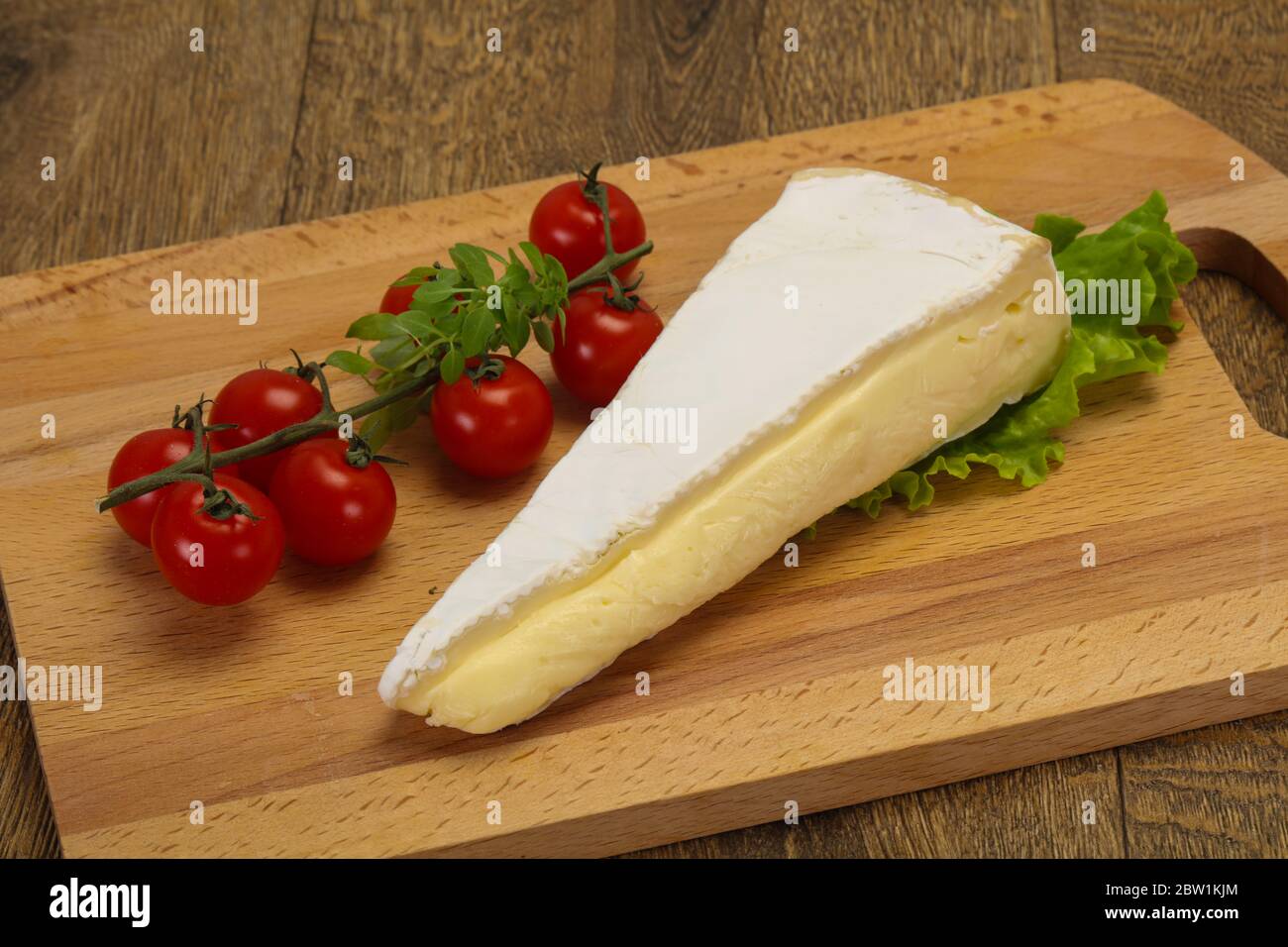 Brie cheese triangle served salad leaves Stock Photo - Alamy