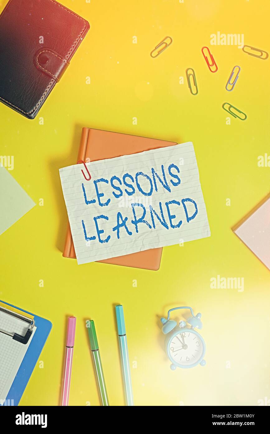 Writing note showing Lessons Learned. Business concept for the knowledge or understanding gained ...