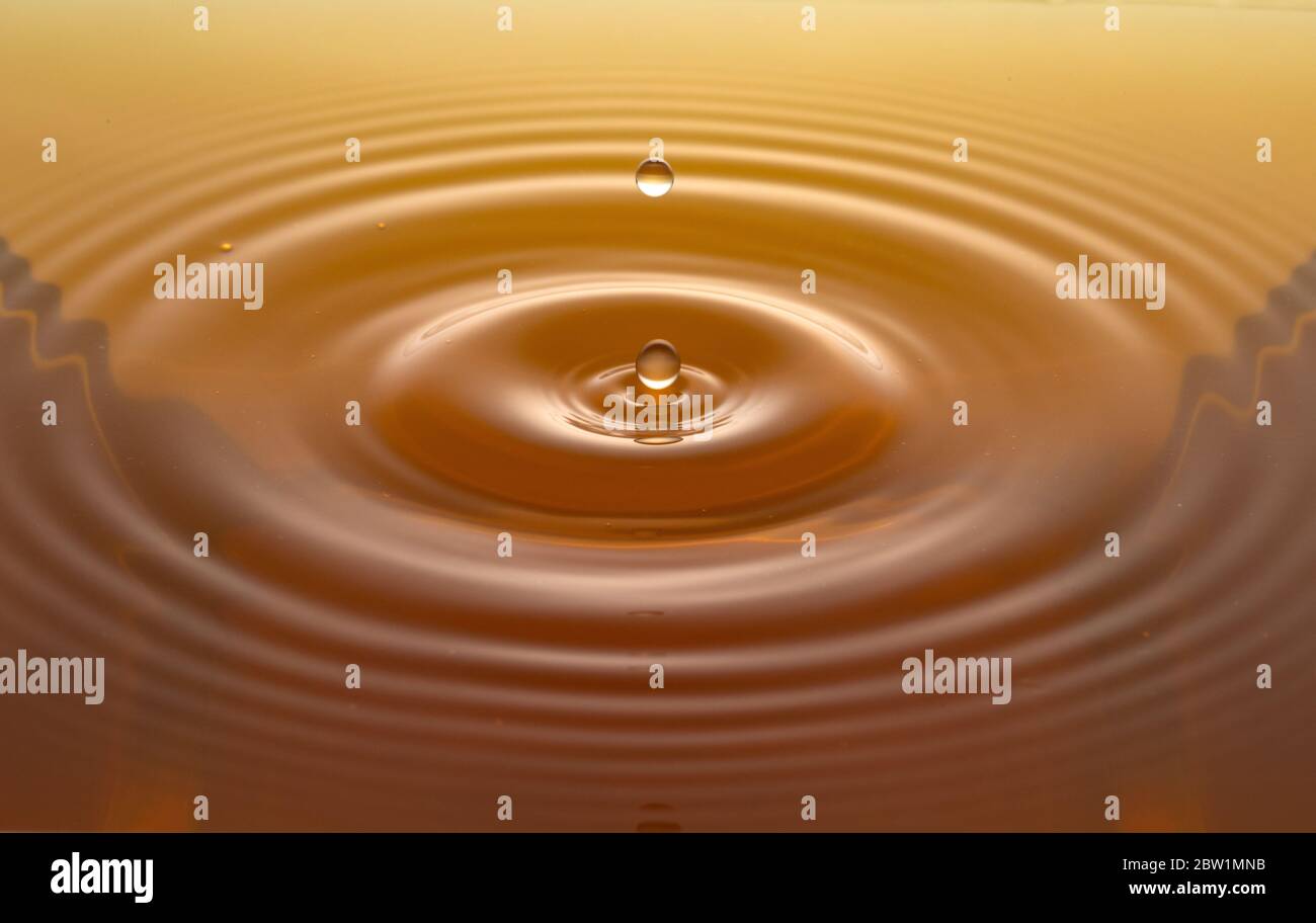 rippling after a few drops of Whiskey Stock Photo - Alamy