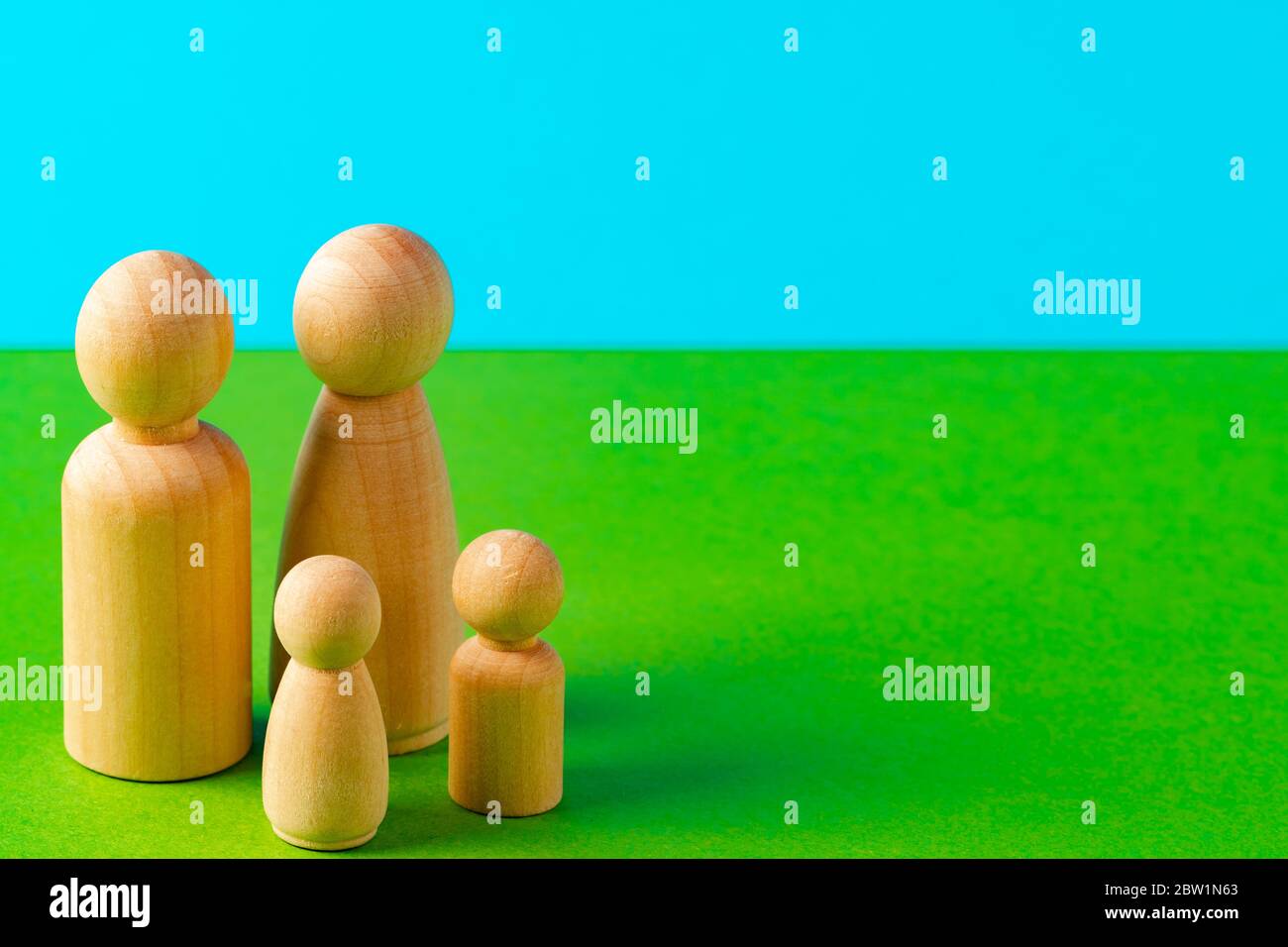 Small wooden figures of family members. Family relationship symbol ...