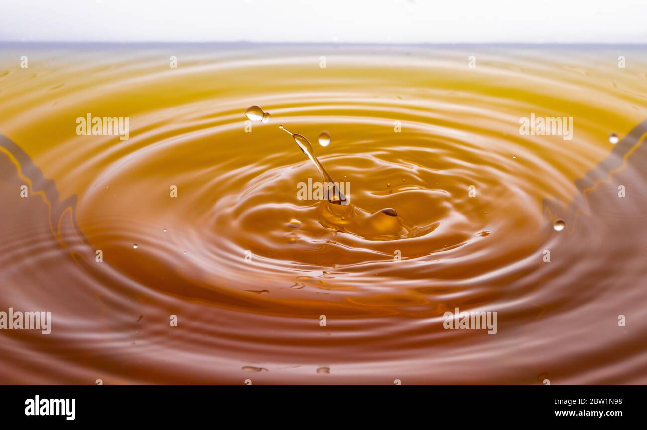 rippling after a few drops of Whiskey Stock Photo - Alamy